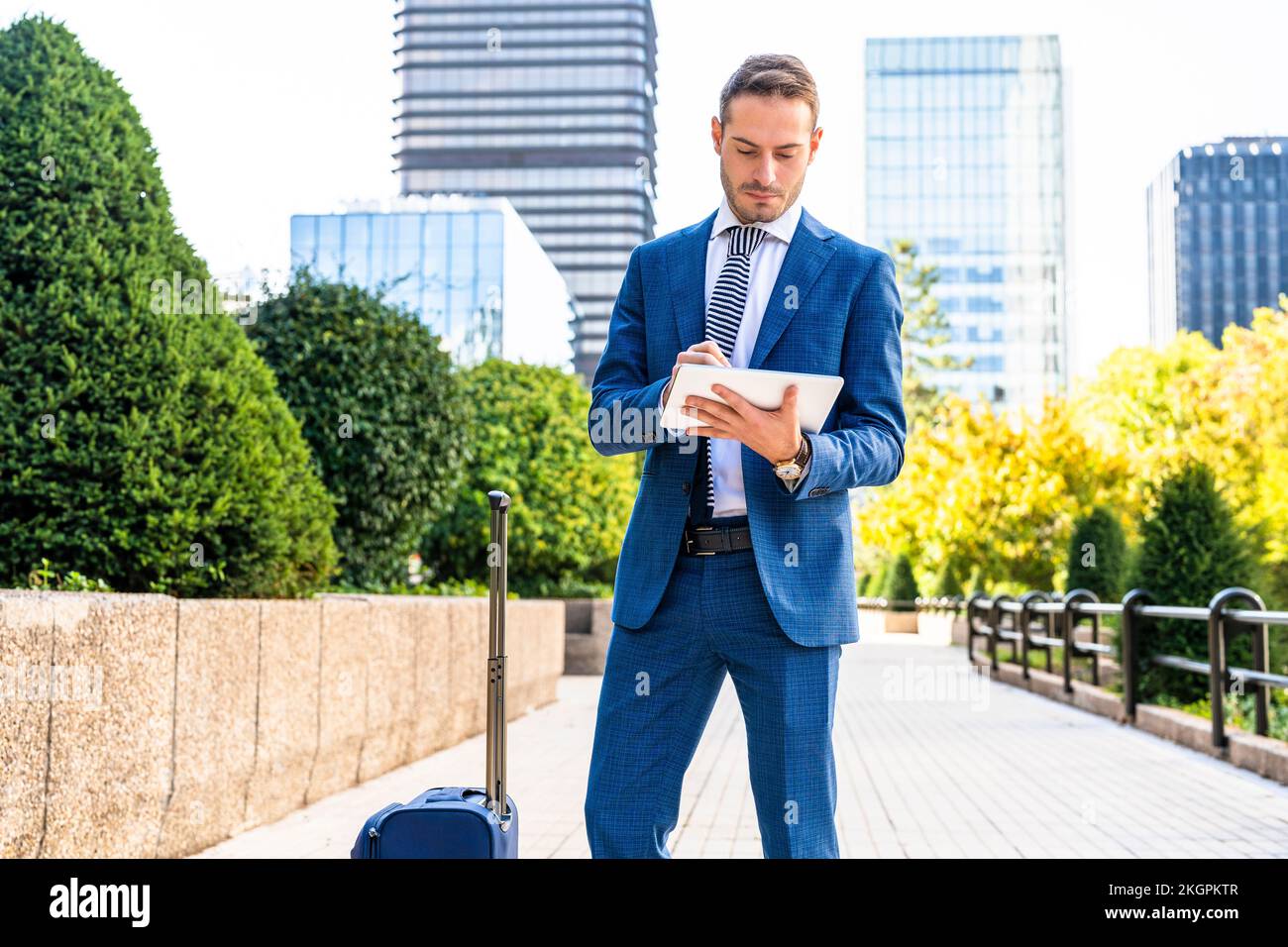 Man in park holding pc hi-res stock photography and images - Alamy