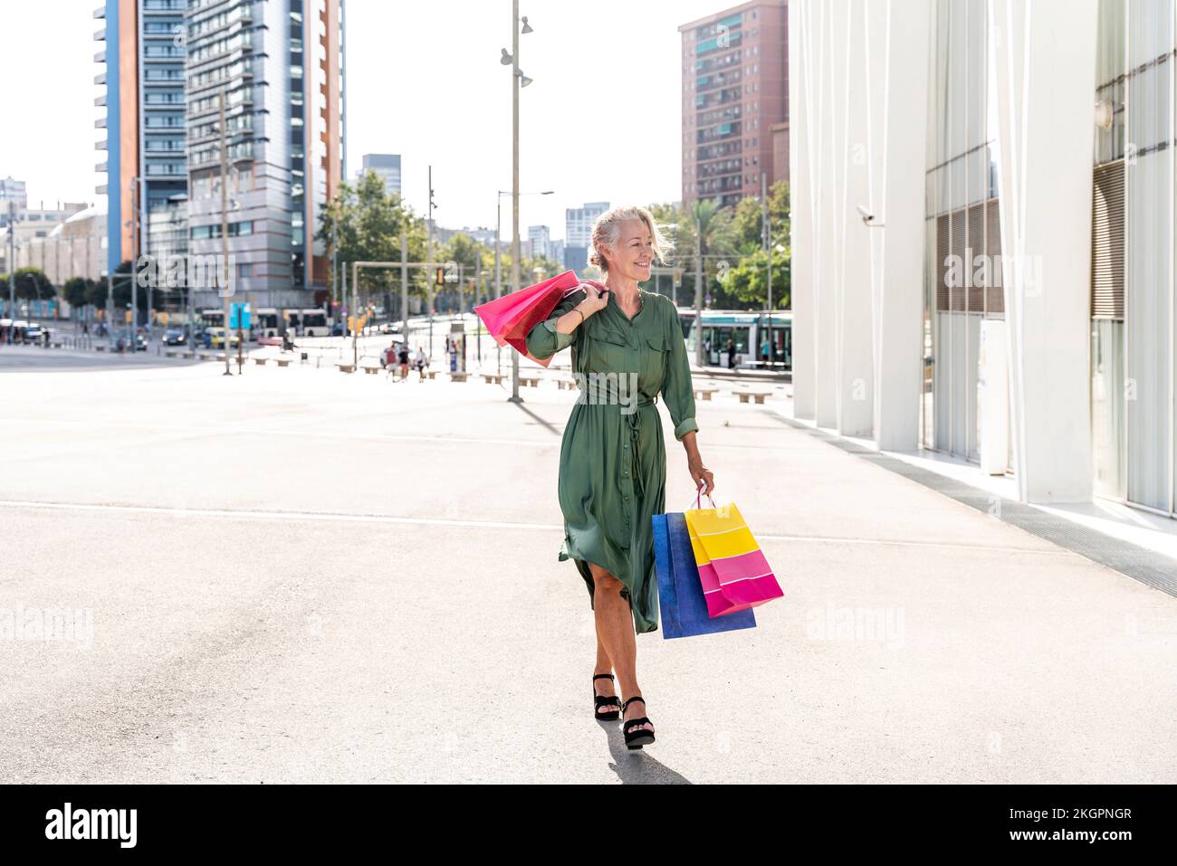 Mature woman carrying shopping bags hi-res stock photography and images - Alamy