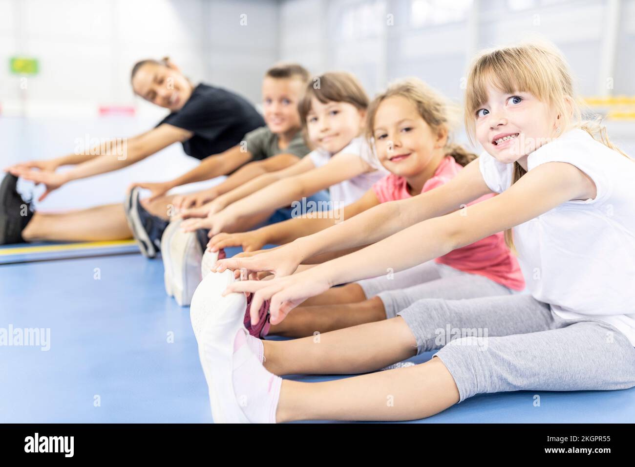Sitting side by side looking away smiling hi-res stock photography and ...