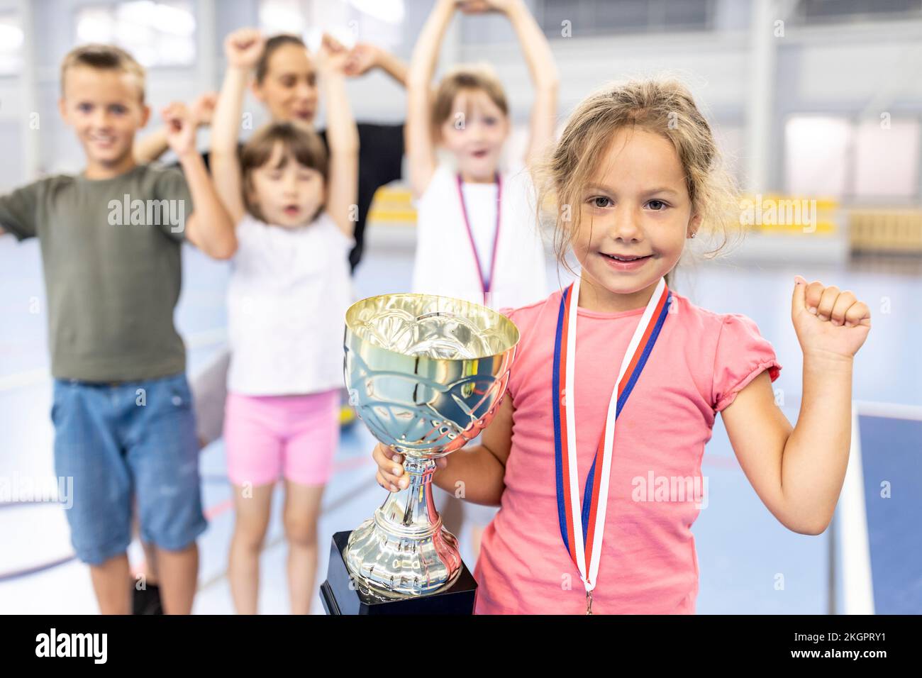 Girl trophy medal hi-res stock photography and images - Alamy