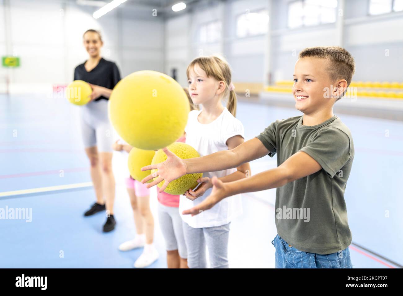Child Catching A Ball