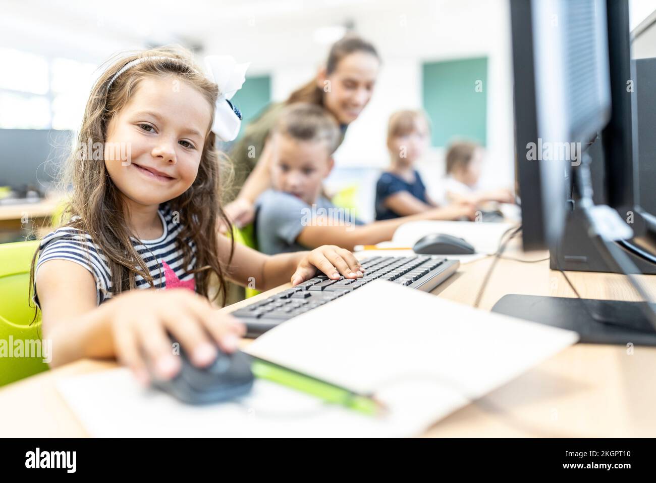 Boy class smiling desk hi-res stock photography and images - Alamy