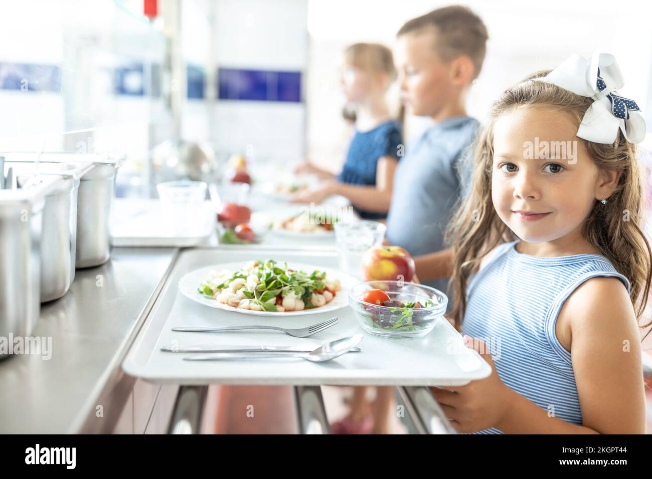 Boy standing in cafeteria with tray hi-res stock photography and images ...
