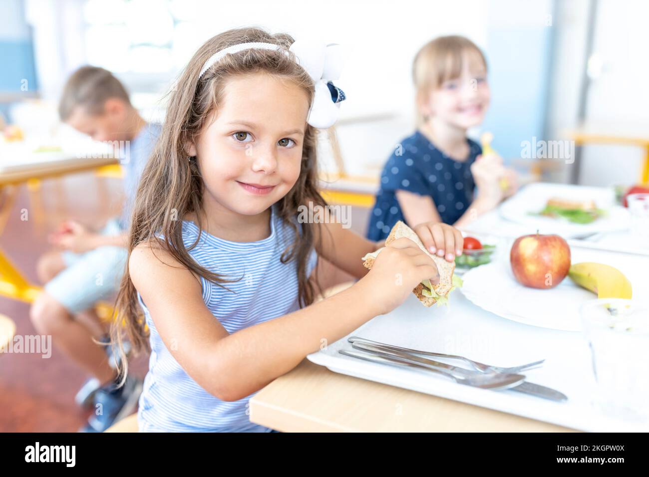 Student having healthy sandwich at lunch break in cafeteria Stock Photo ...