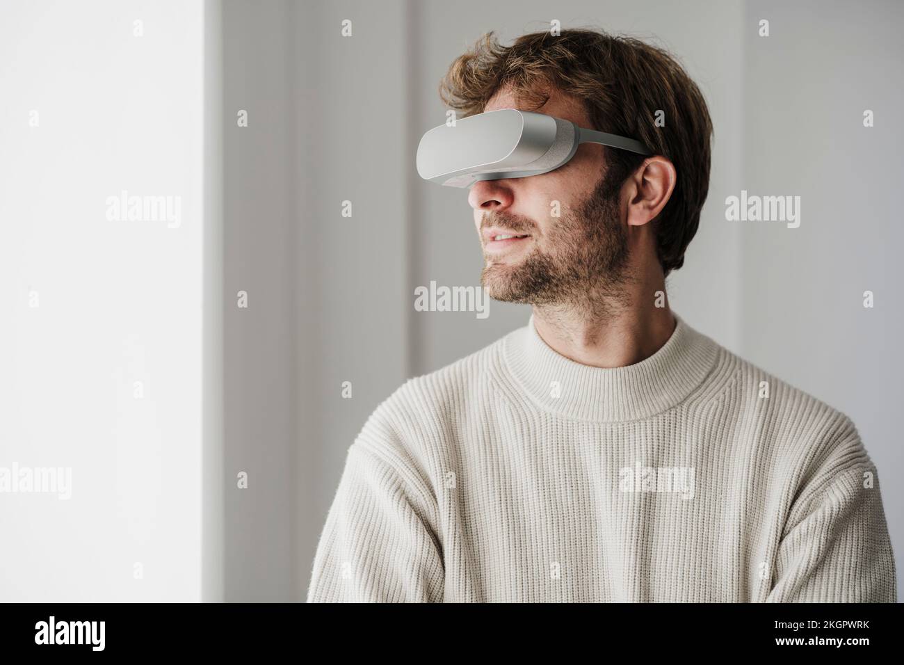 Businessman watching through VR goggles at workplace Stock Photo - Alamy