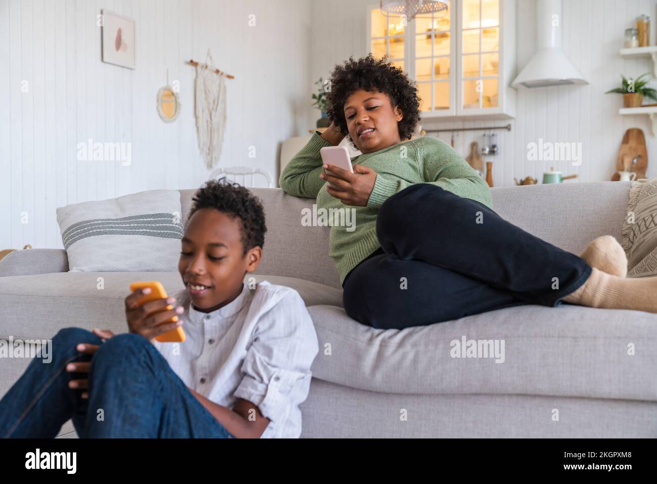 Family using phones hi-res stock photography and images - Alamy
