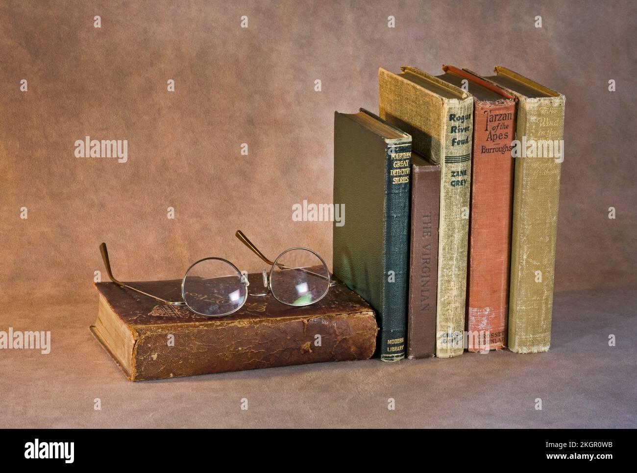 A stack of classic books waiting to be read, including Tarzan of the ...
