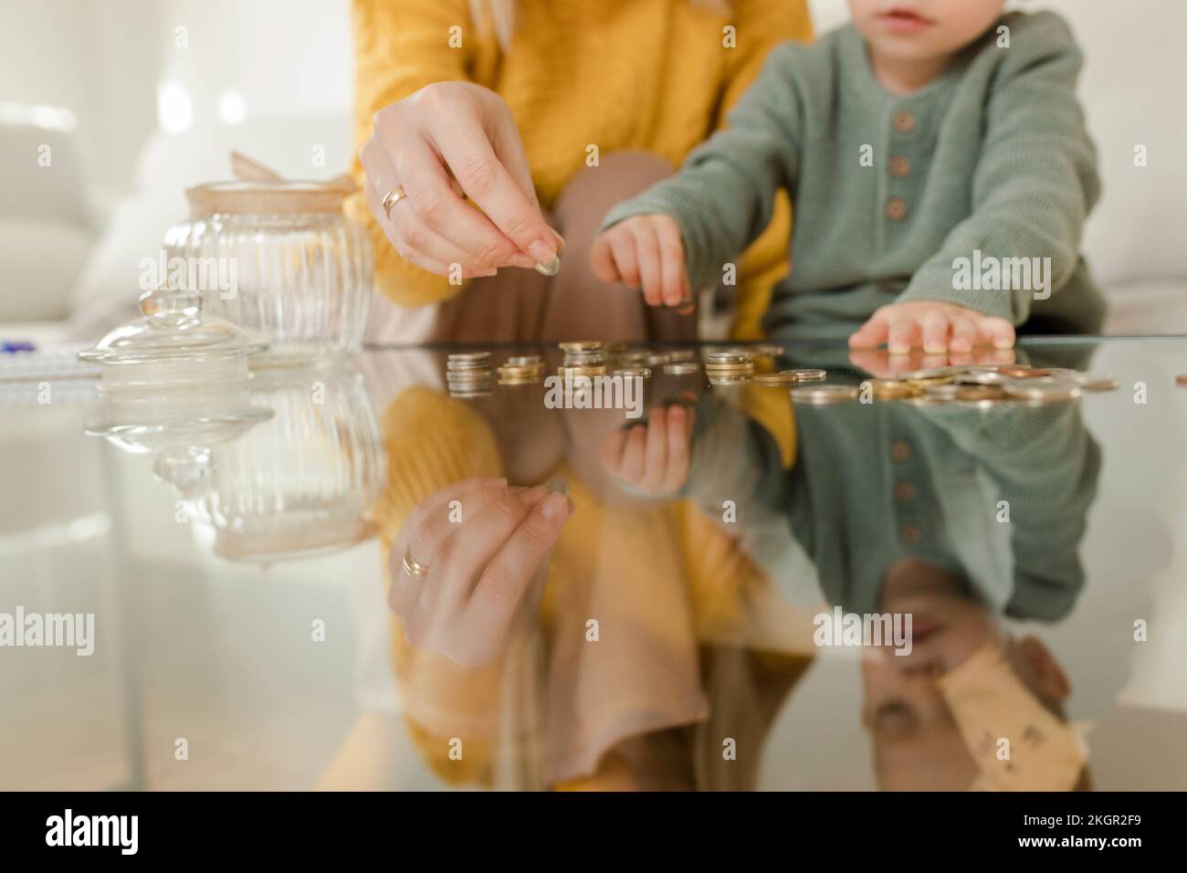 Boy counting money table hi-res stock photography and images - Alamy