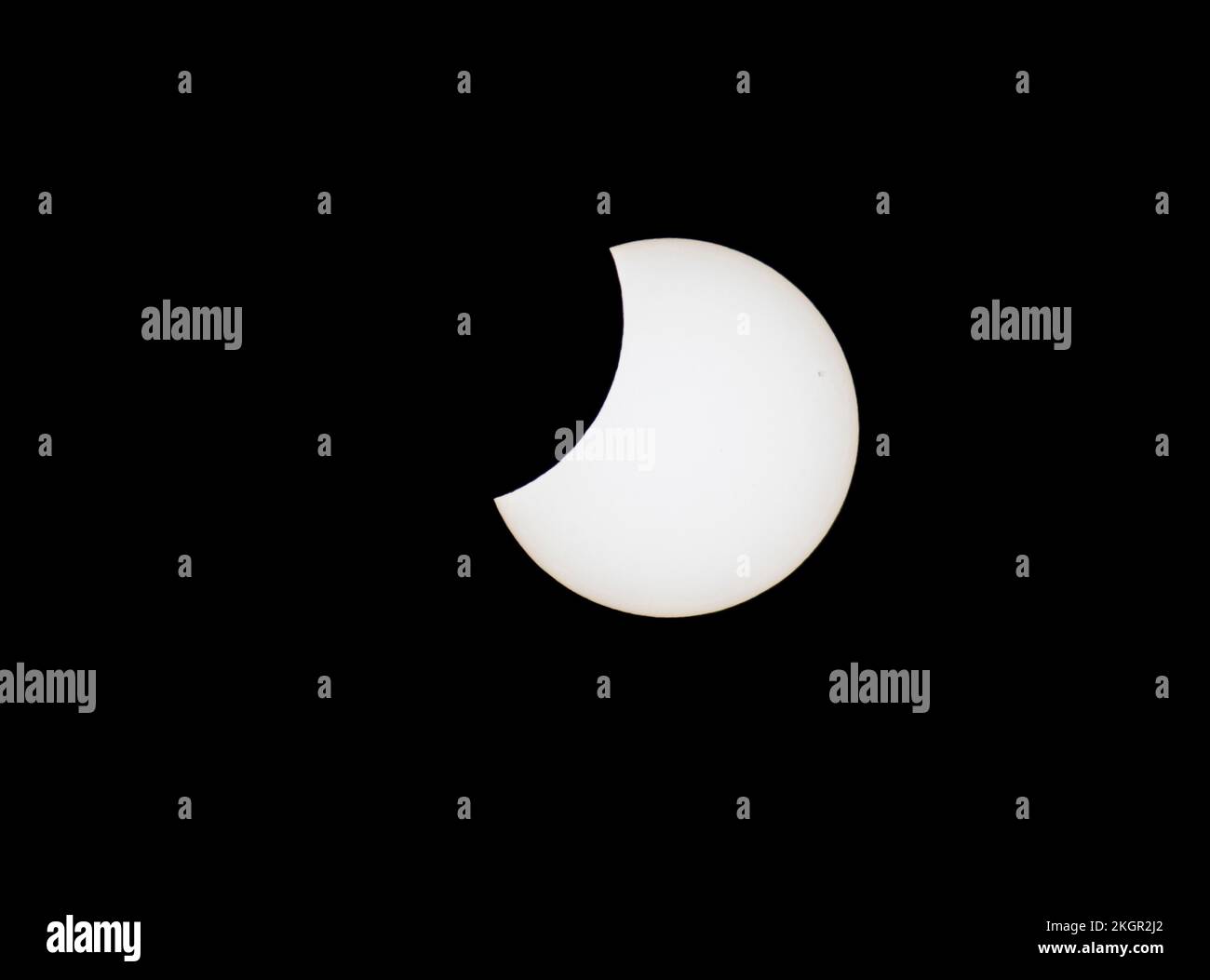 Partial solar eclipse against black sky Stock Photo - Alamy