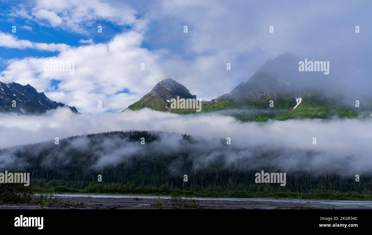 The Chugach Mountain range is covered by mist in Valdez, Alaska, USA ...