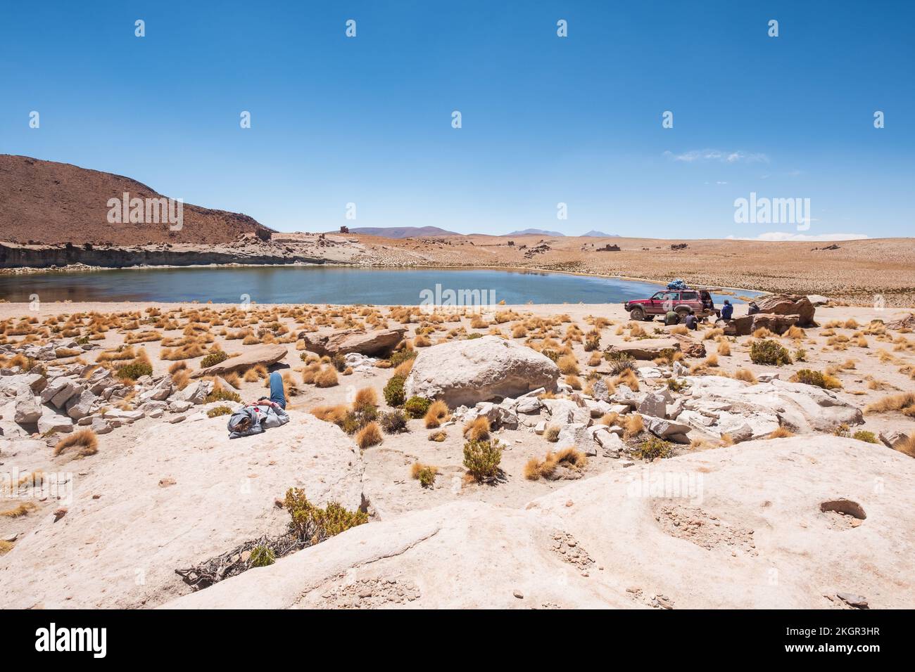 Tourist relaxing during a guided tour to the Laguna Negra (Black Lagoon ...