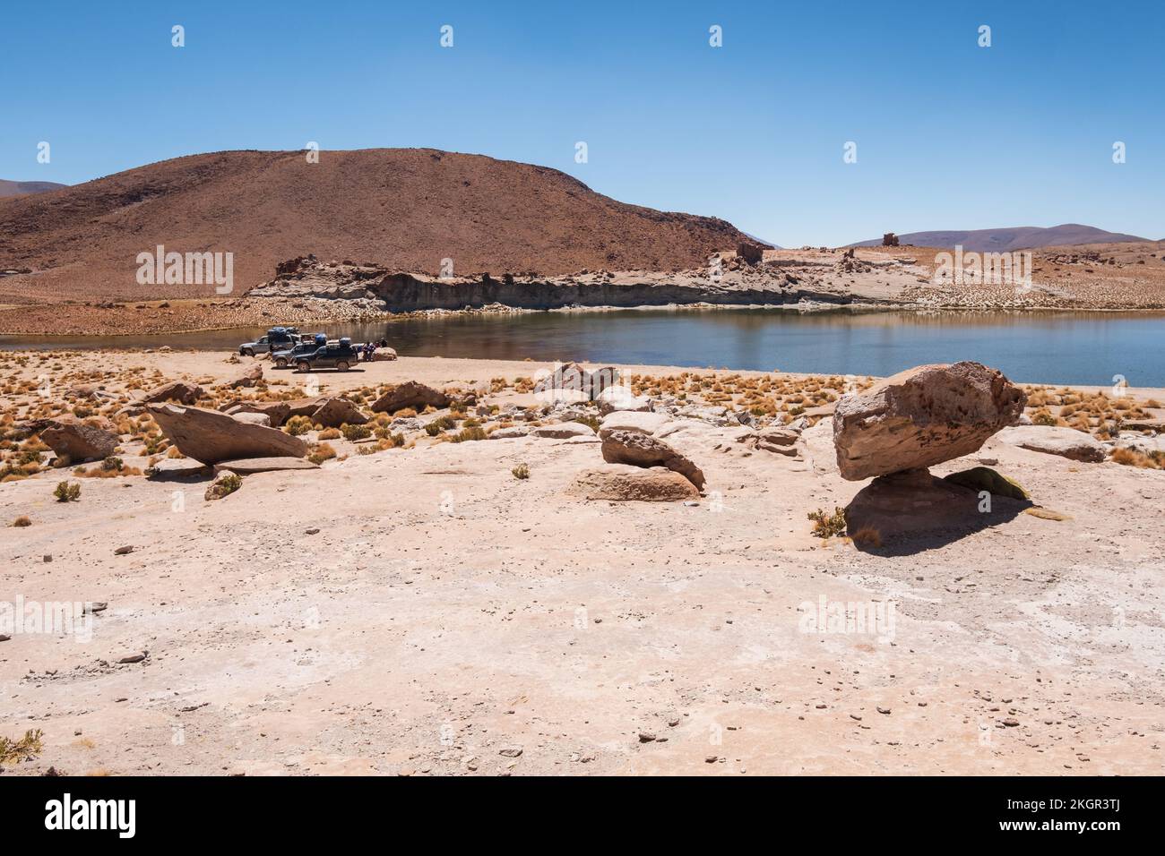 Guided tour jeeps taking a break near the Laguna Negra (Black Lagoon or ...