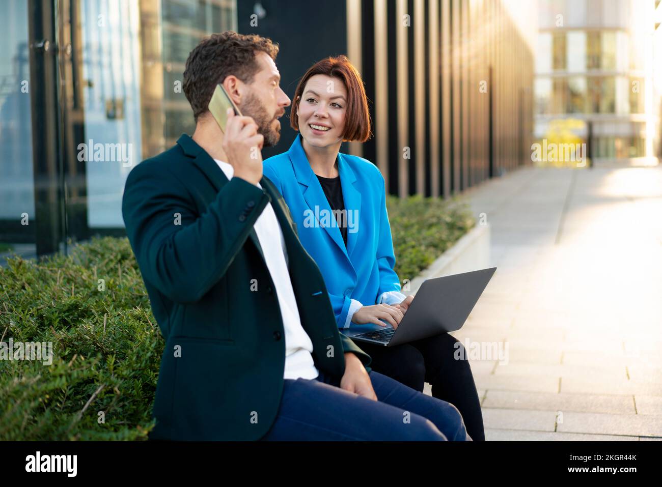 Business colleagues with wireless technology talking to each other ...