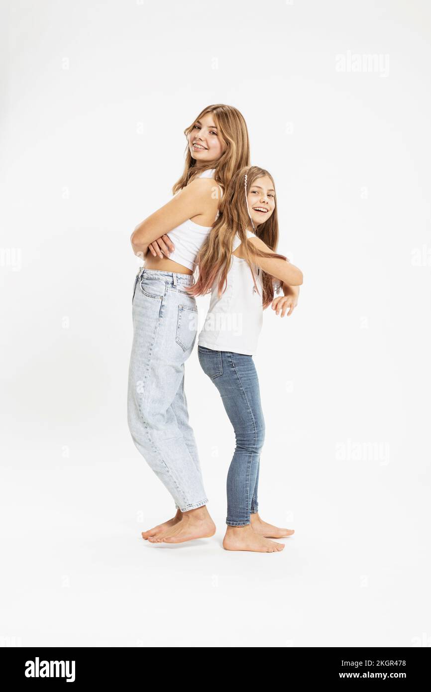 Sisters back back arms crossed hi-res stock photography and images - Alamy