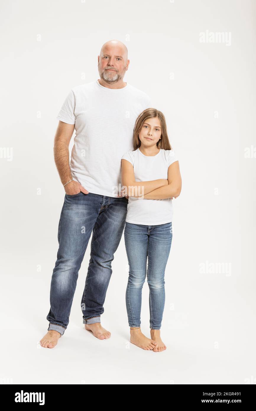 Confident father and daughter against white background Stock Photo - Alamy