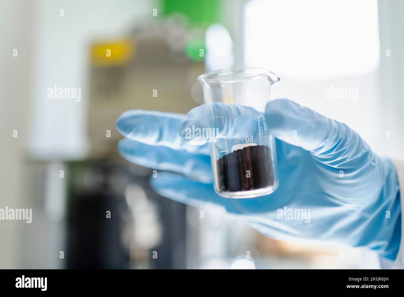Hand of scientist recycling rubber in laboratory Stock Photo - Alamy