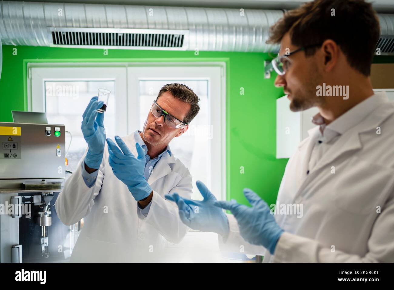 Scientists doing thermolysis experiment at laboratory Stock Photo - Alamy