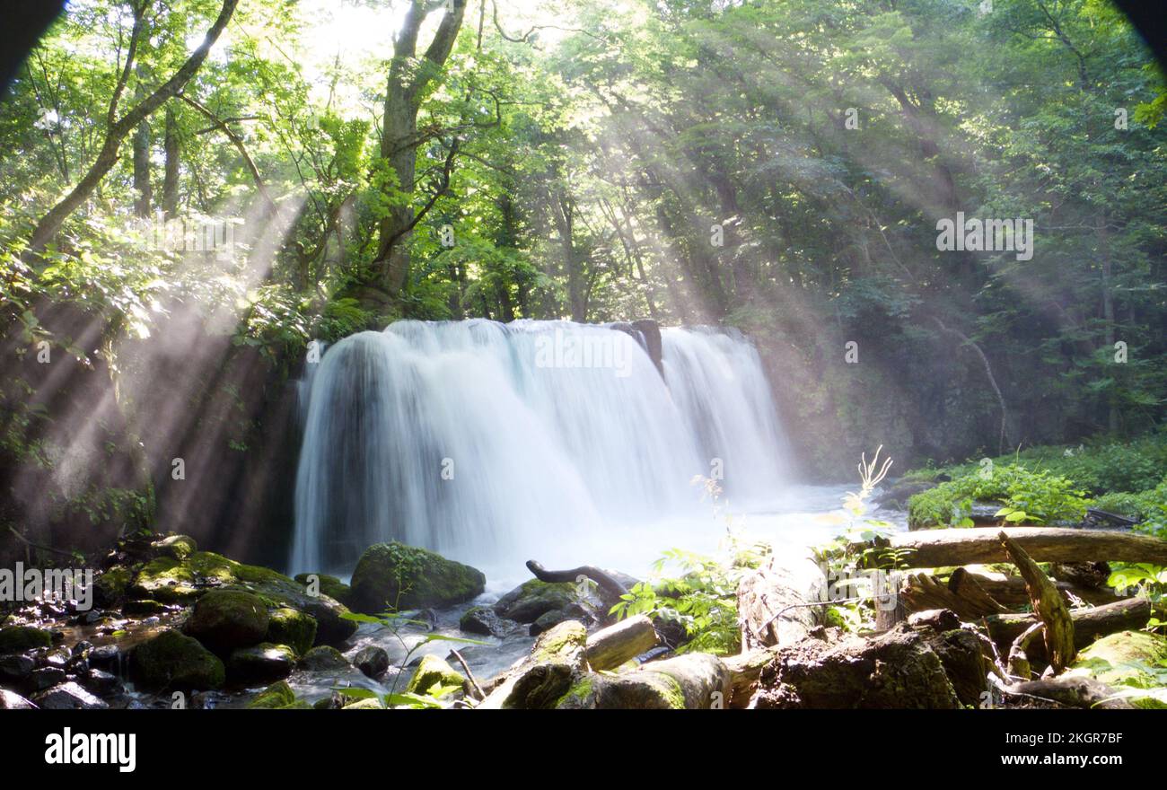 A beautiful shot of sun rays dropping on Choshi waterfall near Lake ...
