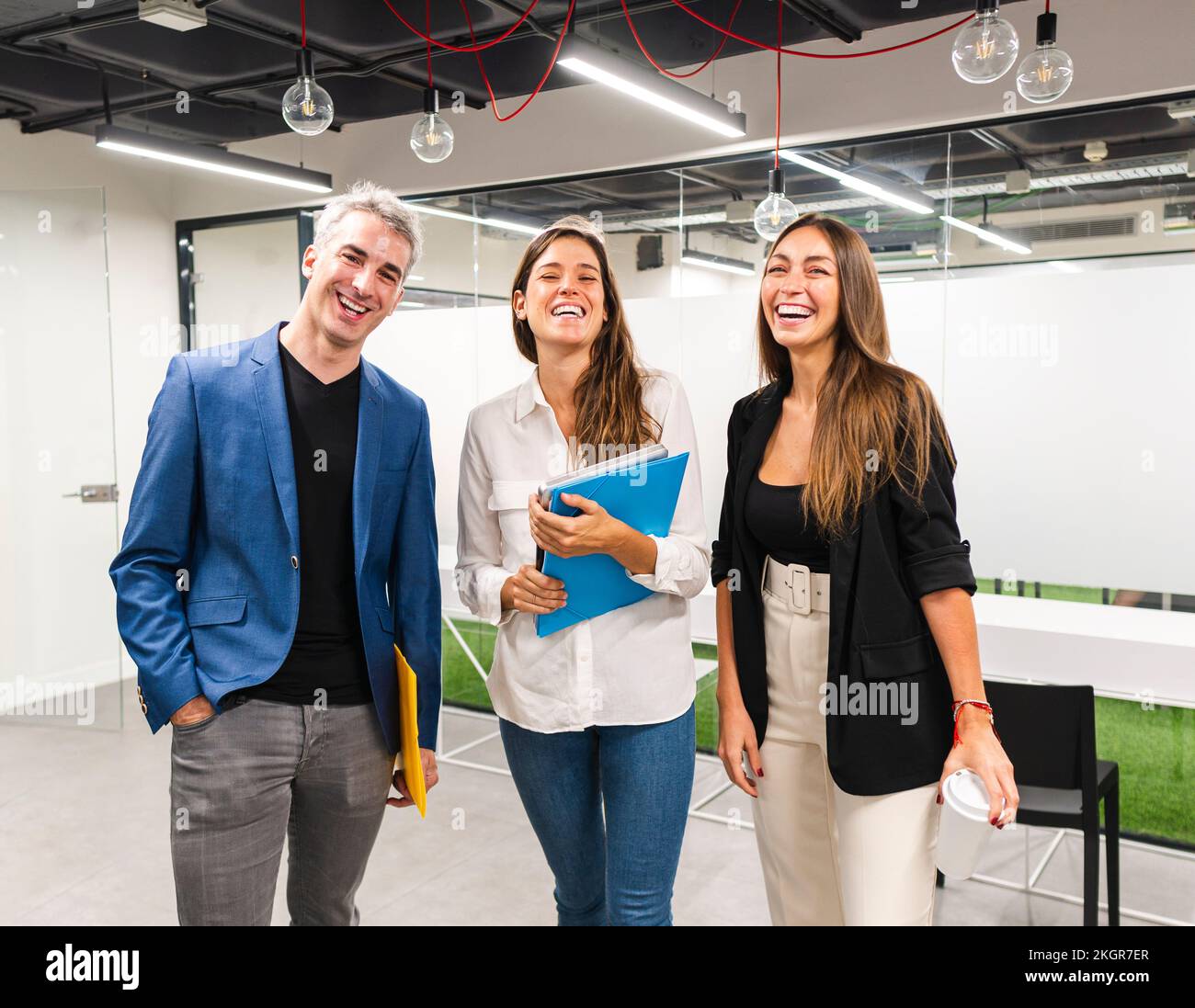 Business colleagues laughing in office Stock Photo - Alamy