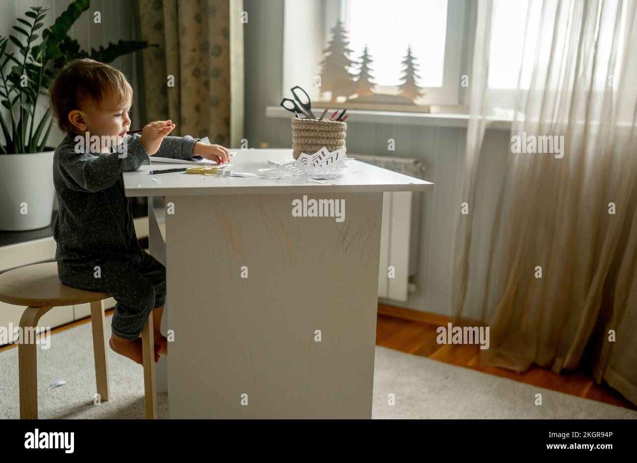 Boy sitting on stool hi-res stock photography and images - Alamy