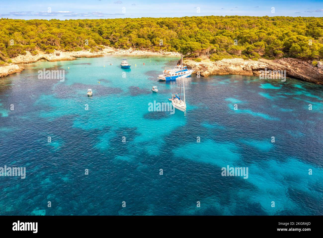 Spain, Balearic Islands, Menorca, Aerial view of boats in Cala Turqueta ...