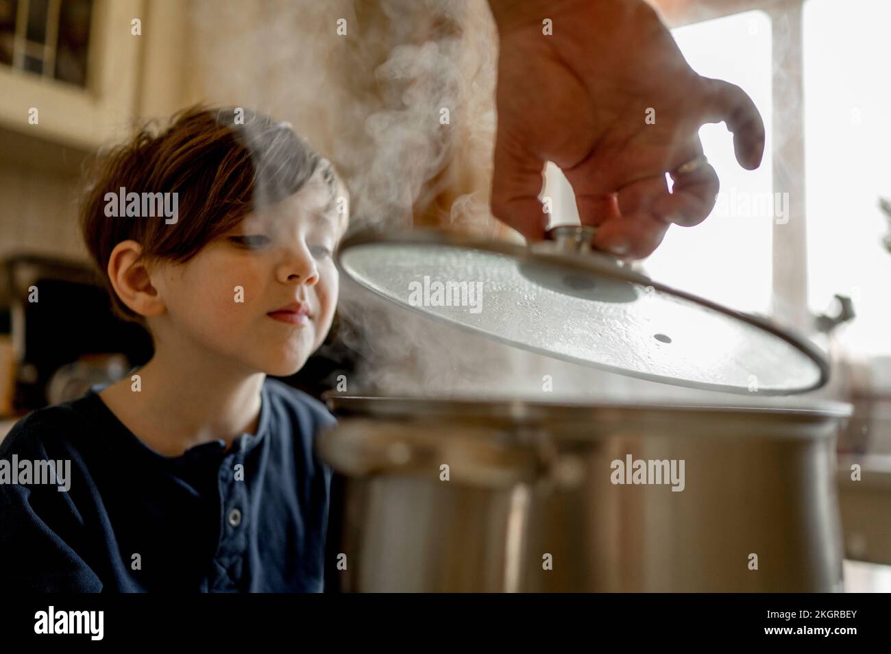 Child smelling food hi-res stock photography and images - Alamy