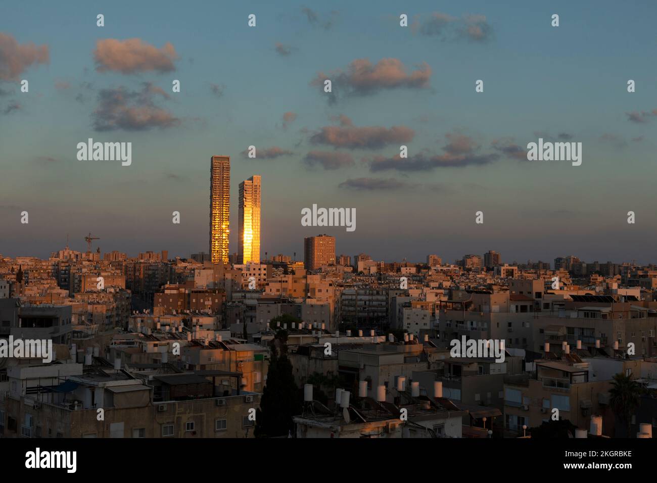 Israel, Bat Yam, Residential district at dusk with two tall skyscrapers ...