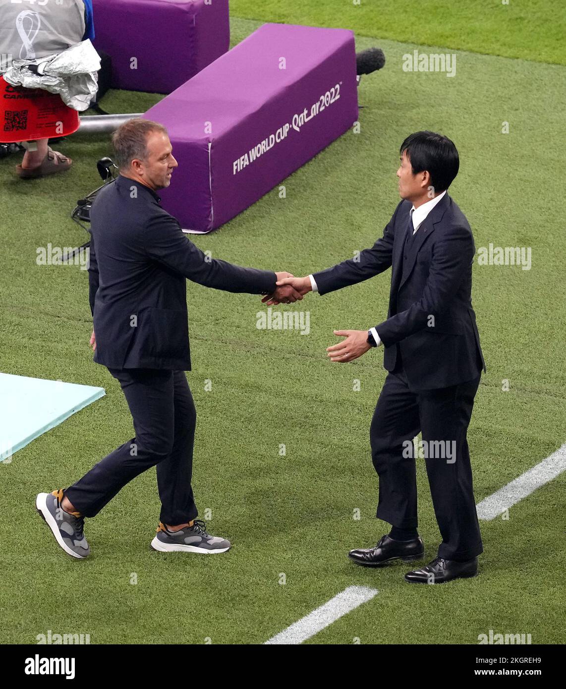 Germany manager Hansi Flick and Japan manager Hajime Moriyasu shake ...
