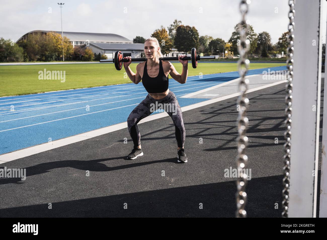 Athlete exercising barbell running hi-res stock photography and images ...