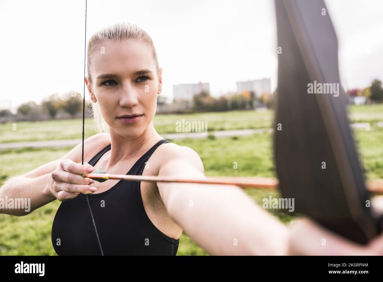 Young female archer practicing archery hi-res stock photography and ...
