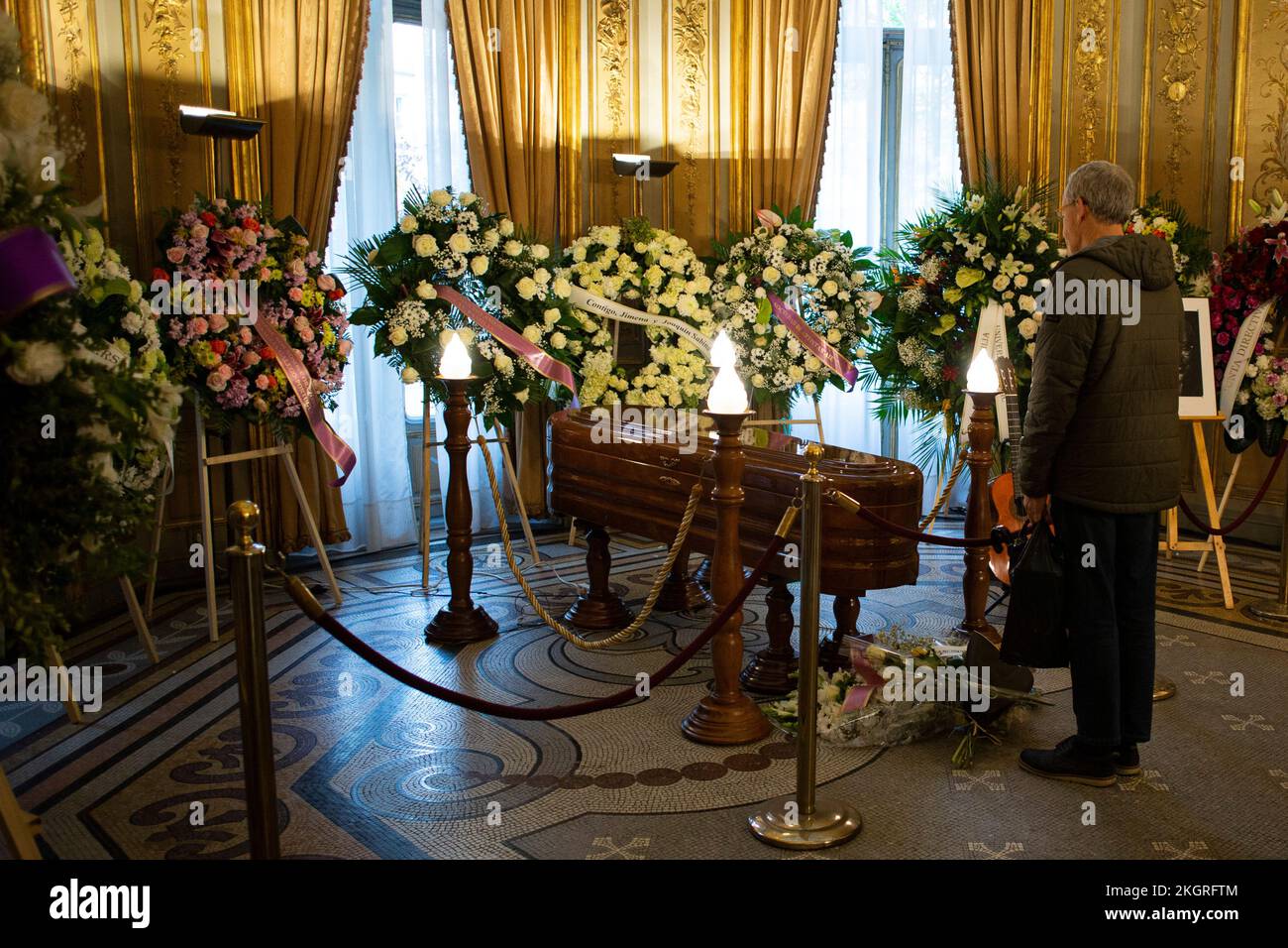 Madrid, Spain. 23rd Nov, 2022. A man pays his respects in front of the ...