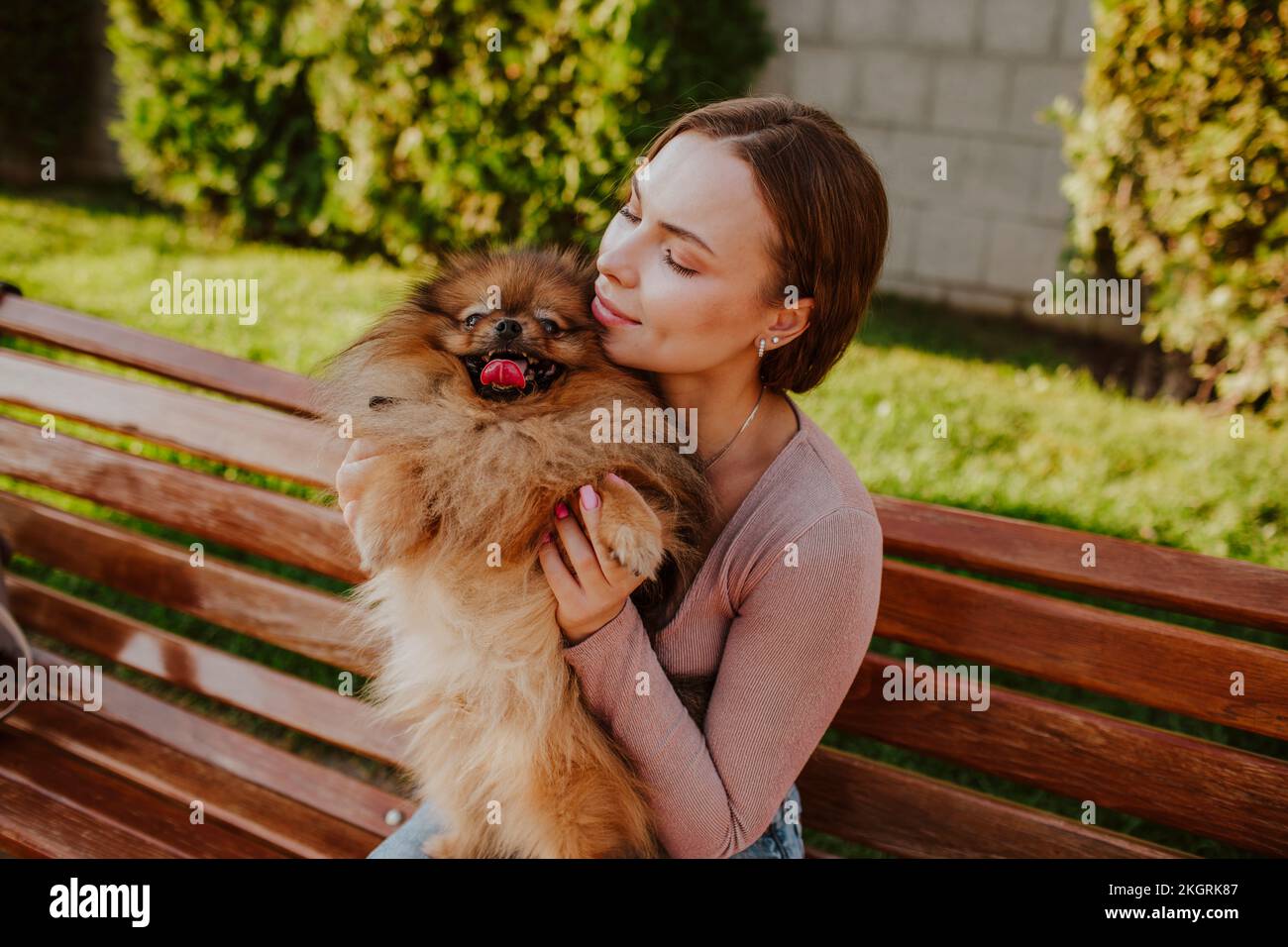Women holding dog hi-res stock photography and images - Alamy