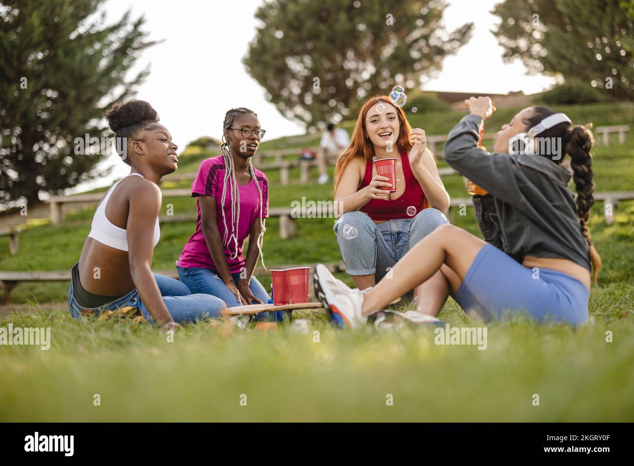 Group friends blowing bubbles hi-res stock photography and images - Alamy