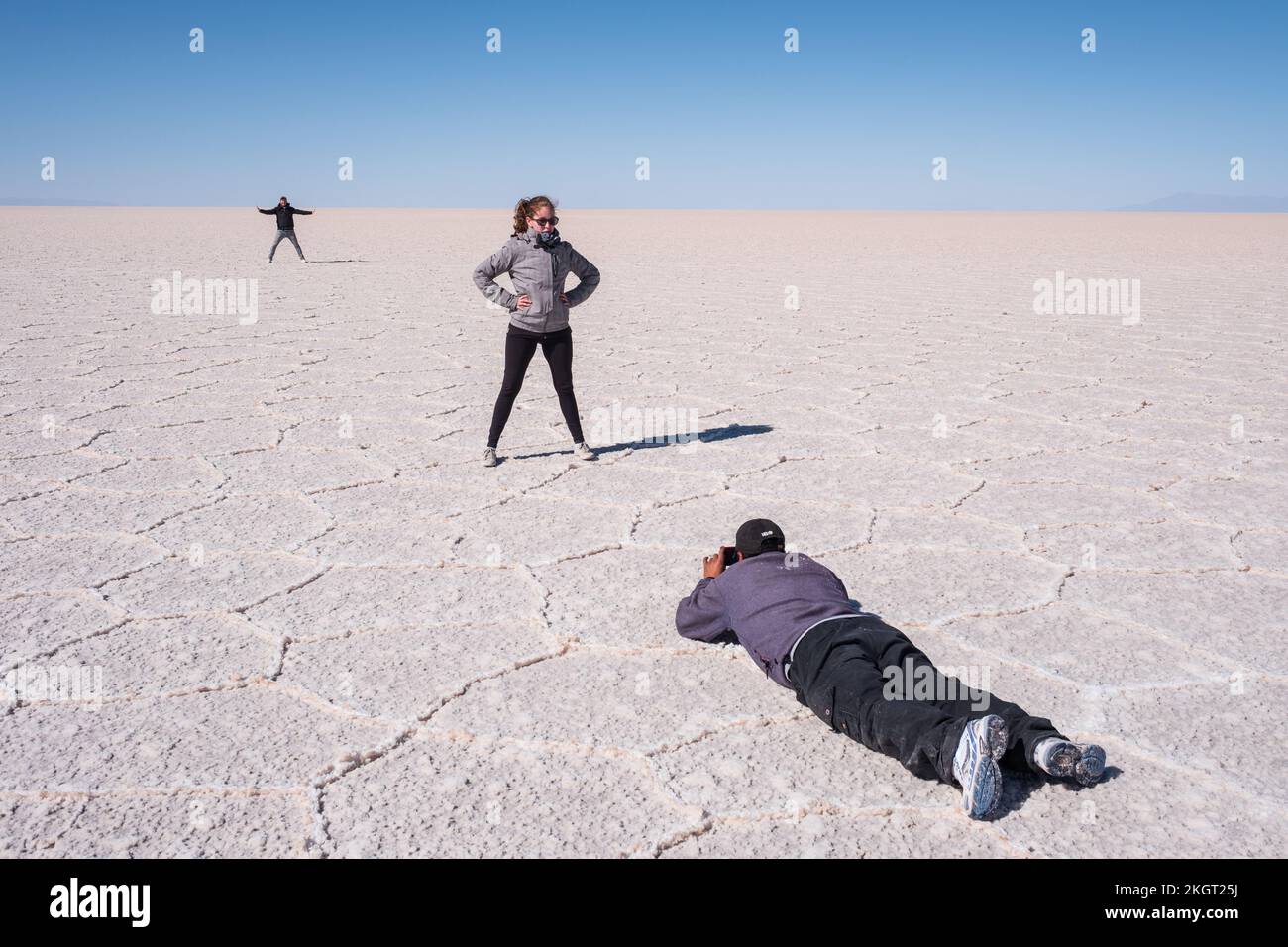 Tourists making funny pictures on the Salar de Uyuni (Uyuni Salt Flat ... Tourists making funny pictures on the Salar de Uyuni (Uyuni Salt Flat ...