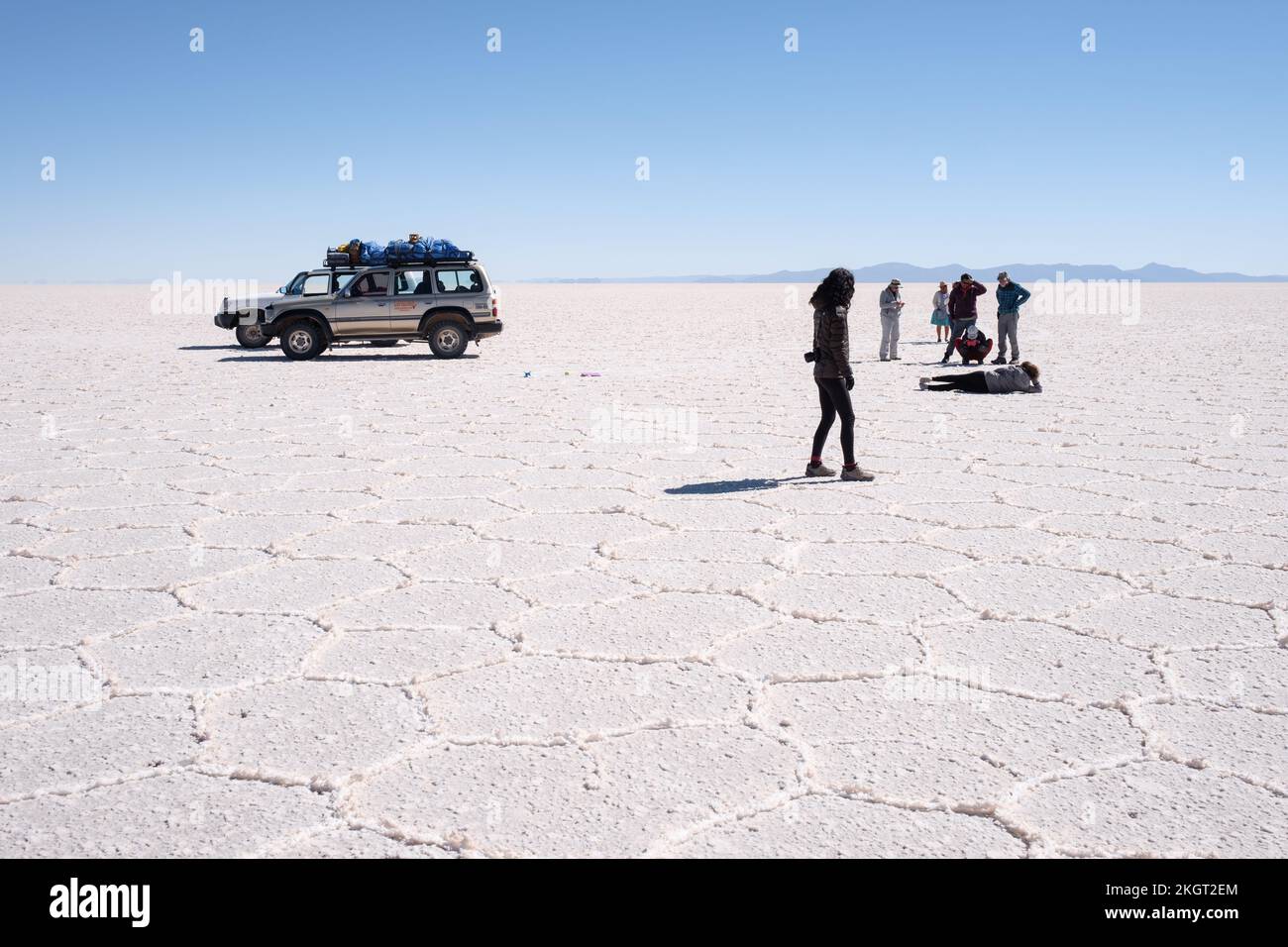 Tourists making funny pictures on the Salar de Uyuni (Uyuni Salt Flat ... Tourists making funny pictures on the Salar de Uyuni (Uyuni Salt Flat ...