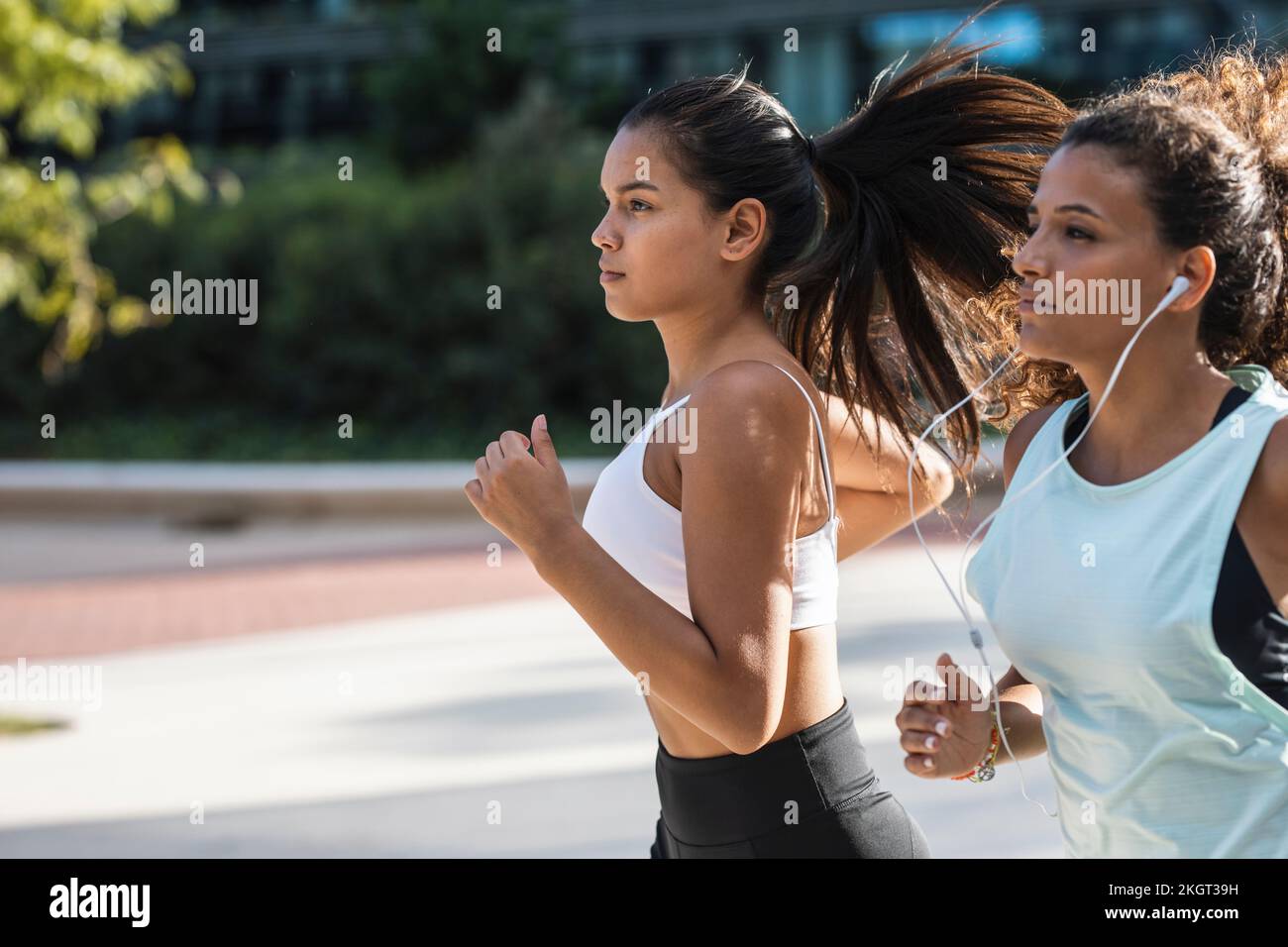 Running with friend woman hi-res stock photography and images - Alamy