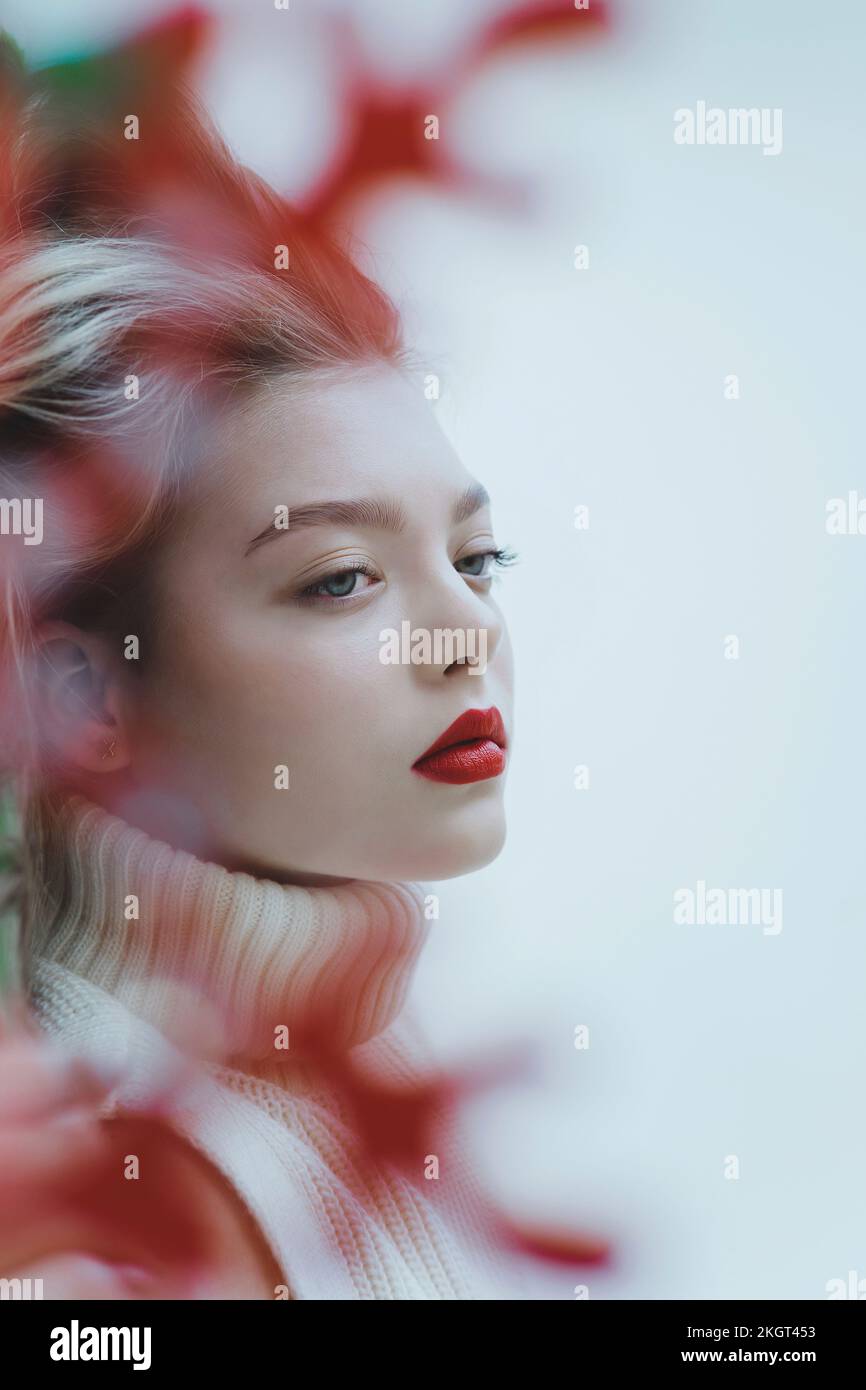 Contemplative girl with red lipstick Stock Photo - Alamy