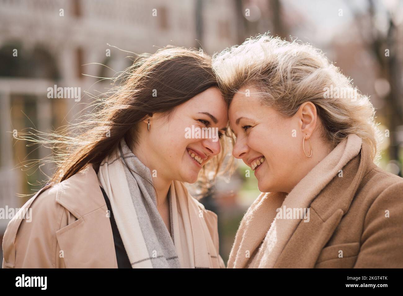 Happy mother and daughter touching foreheads Stock Photo - Alamy