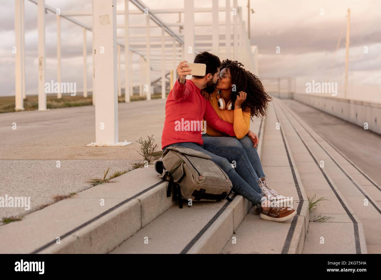 Young couple kissing taking hi-res stock photography and images - Alamy