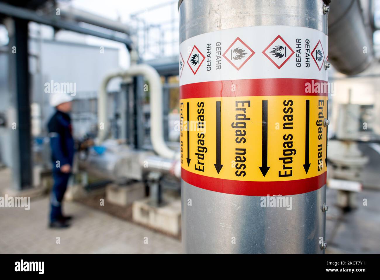 Rehden, Germany. 23rd Nov, 2022. Pipes labeled "Natural gas wet" run ...