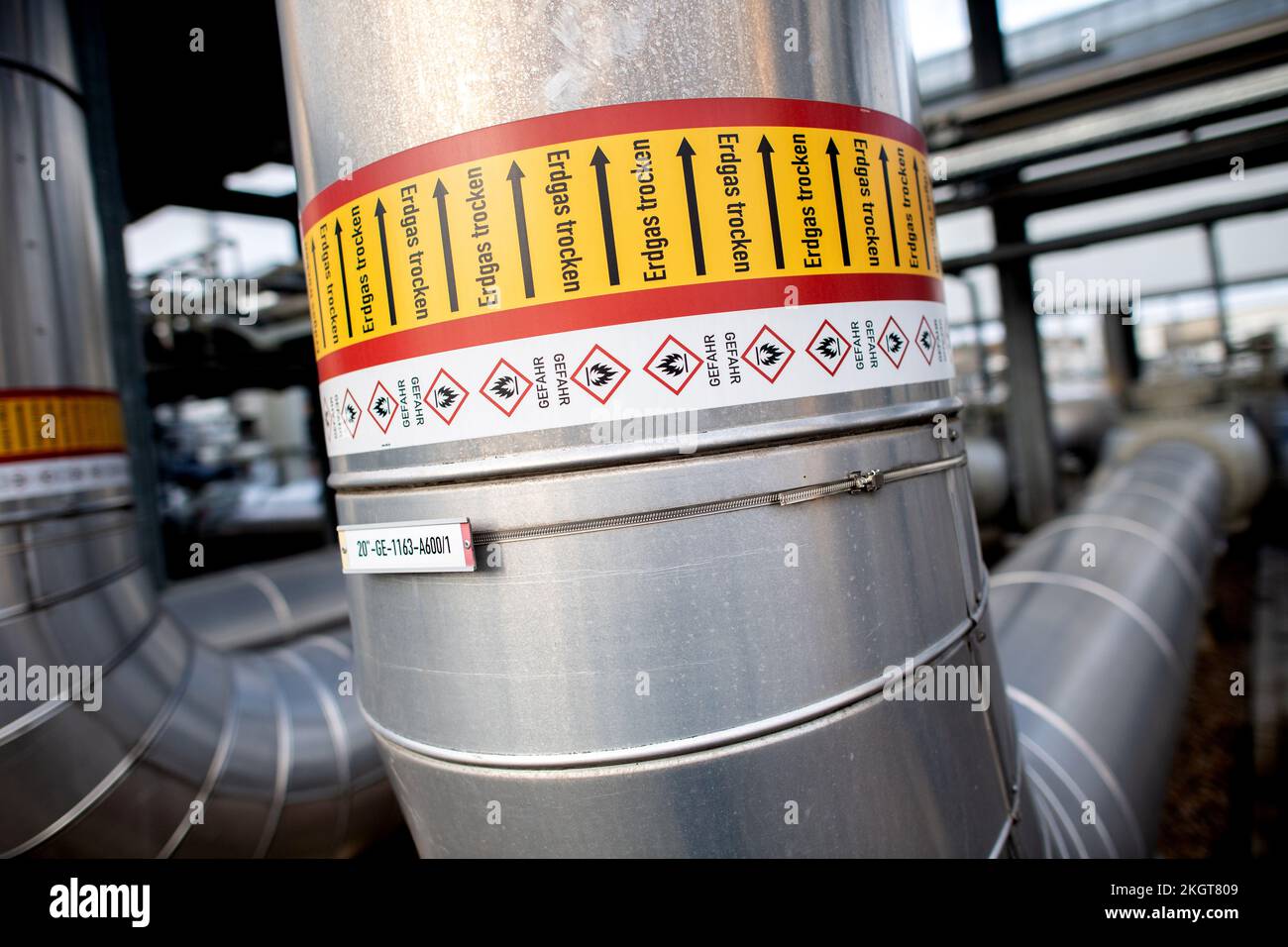 Rehden, Germany. 23rd Nov, 2022. Pipes labeled "Natural gas dry" run ...