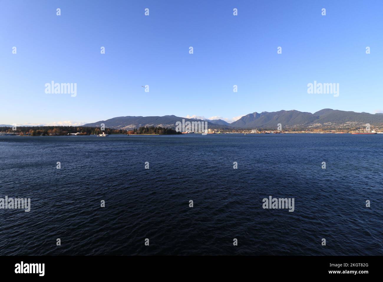 A beautiful scenery of a lake under a clear blue sky in Vancouver ...