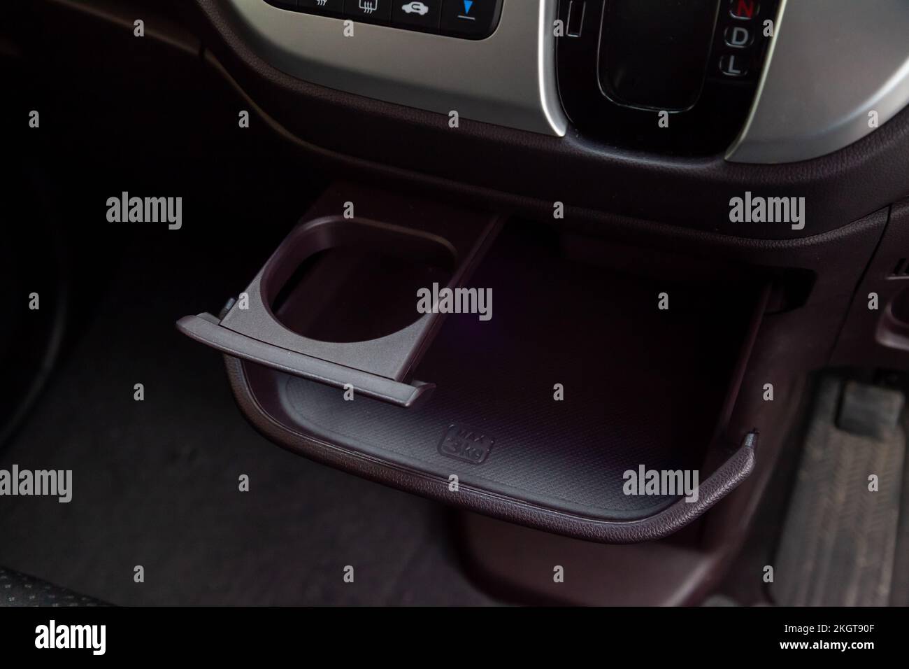 Interior view with cupholder and pocket on front panel on the kei car ...