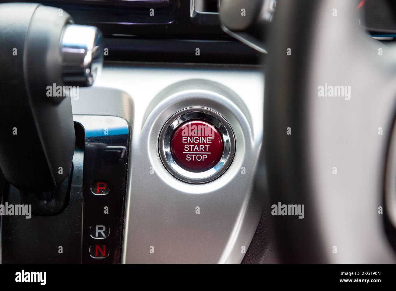 Red Button start and turn off the ignition of the car engine close-up ...
