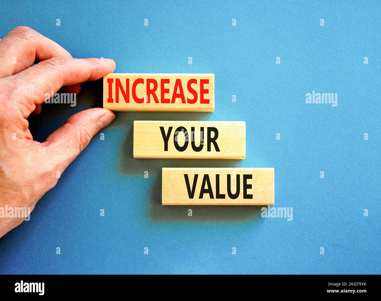 Increase your value symbol. Concept words Increase your value on wooden ...