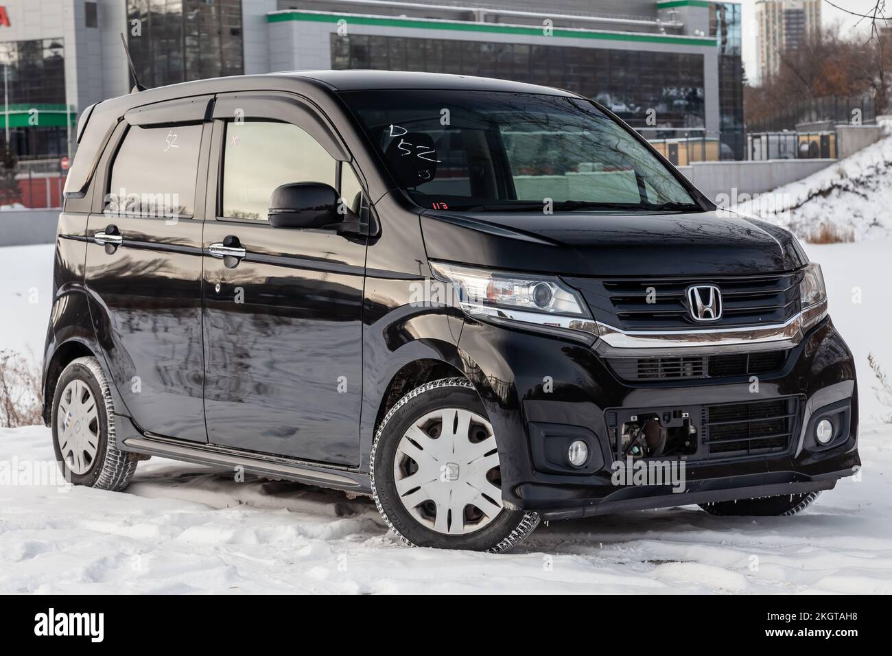 Novosibirsk, Russia - 11.20.2022: Front view of black Honda N-Wgn Custom 700 CC engine is parked ...