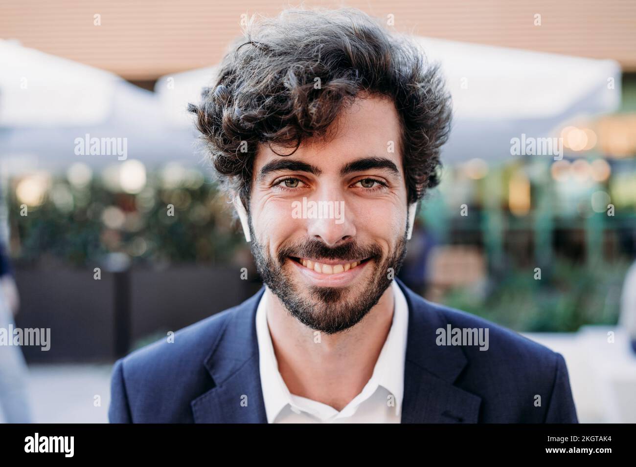 Smiling handsome businessman with hair stubble Stock Photo - Alamy