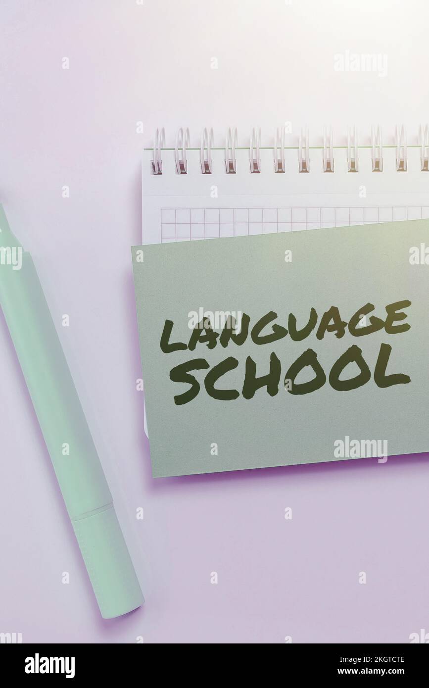 Hand writing sign Language School. Word Written on educational ...