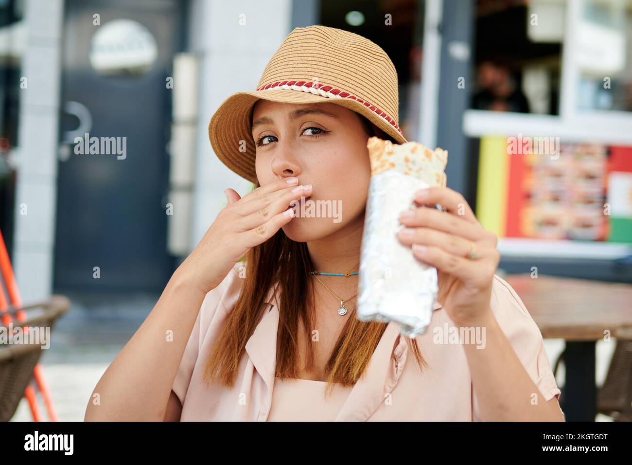 Girl woman eating a burrito hi-res stock photography and images - Alamy