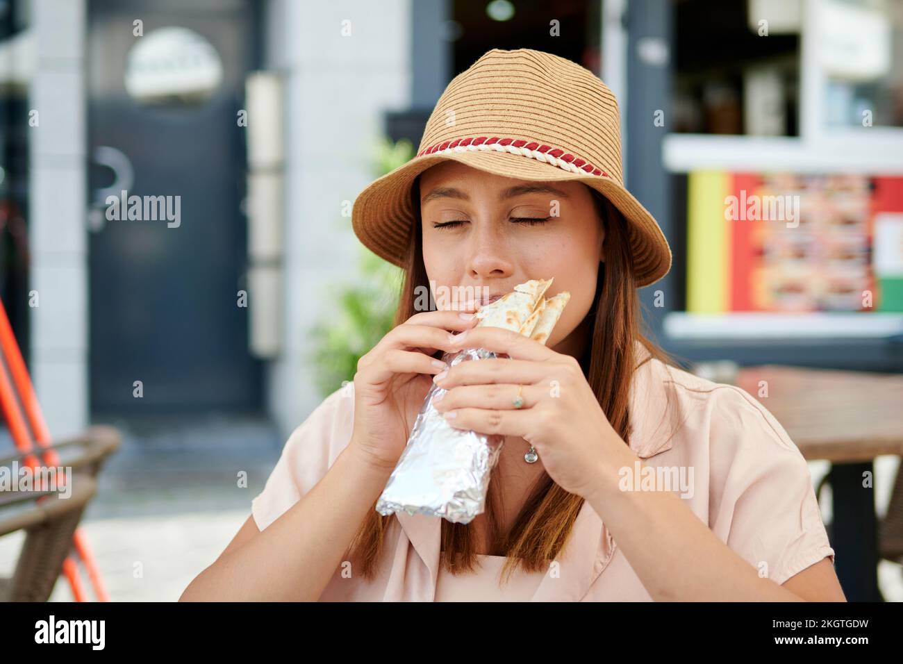 Girl woman eating a burrito hi-res stock photography and images - Alamy